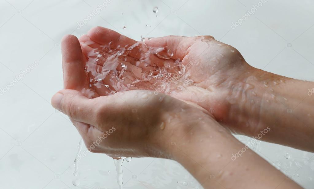 Female hands over clear water — Stock Photo © belchonock #82105336