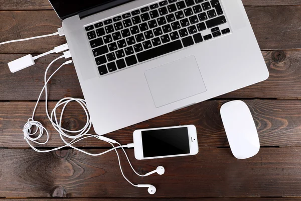 Computer peripherals and laptop accessories on wooden background ...