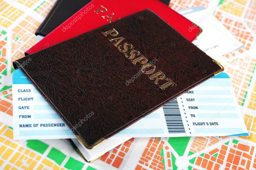 Passports with tickets on map background Stock Photo by ©belchonock ...