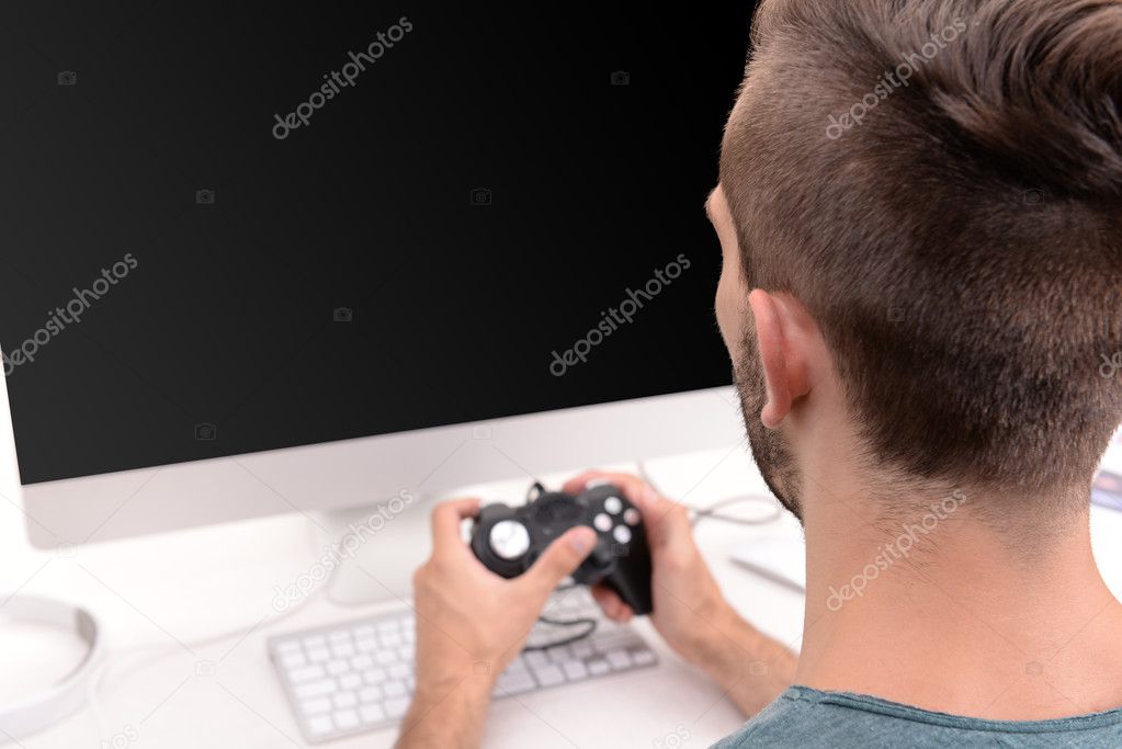 Man playing computer games — Stock Photo © belchonock #84296950