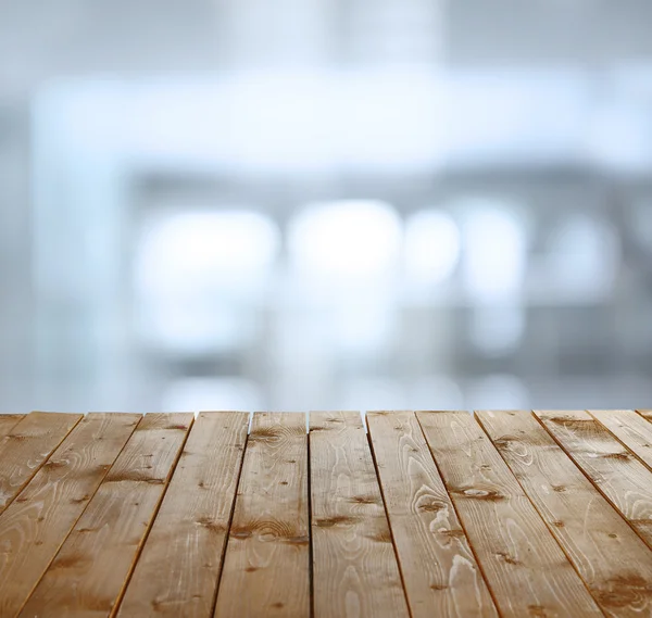 Wooden table on room background Stock Photo by ©belchonock 25411513