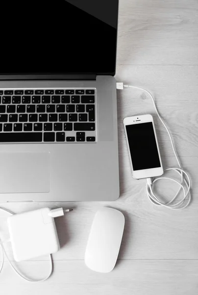Computer peripherals and laptop accessories on wooden background ...
