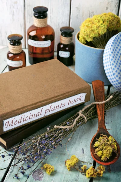 Medicinal plants book with dried herbs - Stock Image - Everypixel