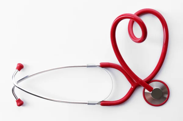 Red stethoscope and heart — Stock Photo © belchonock #113560476