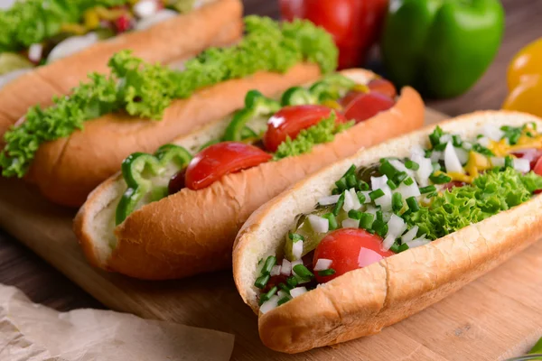 Hot dogs and vegetables — Stock Photo © belchonock #87155684