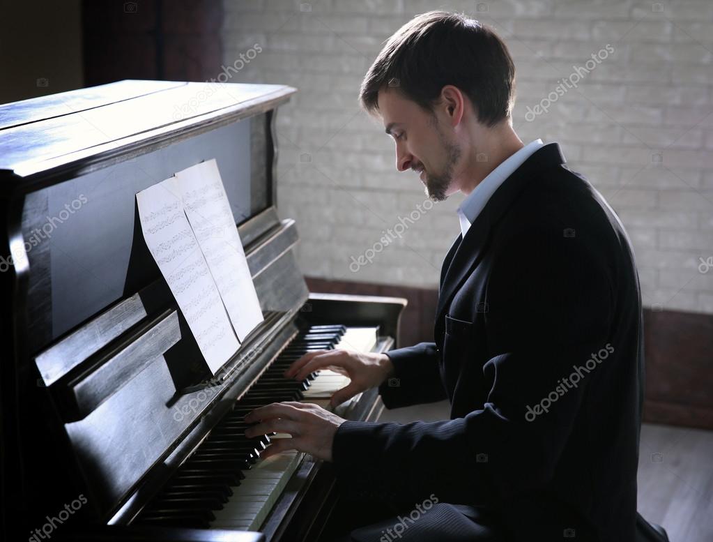 Handsome Man Playing Piano