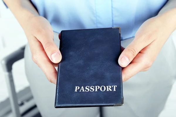Hand holding passport Stock Photo by ©belchonock 93109936