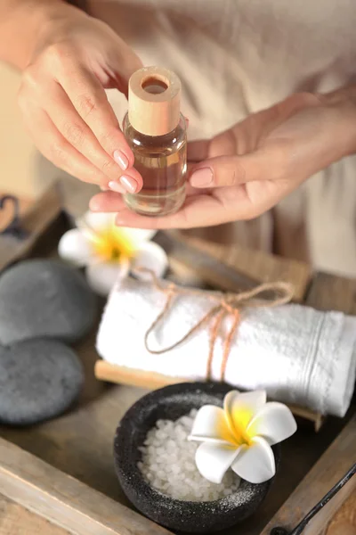 Hands with tray of spa products - Stock Image - Everypixel