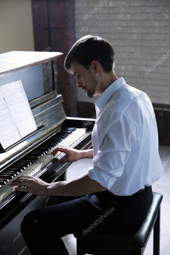 Handsome Man Playing Piano