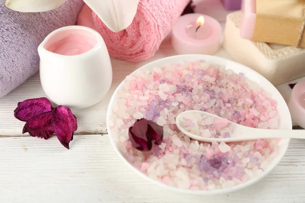 Beautiful spa composition with spring flowers on wooden background ...