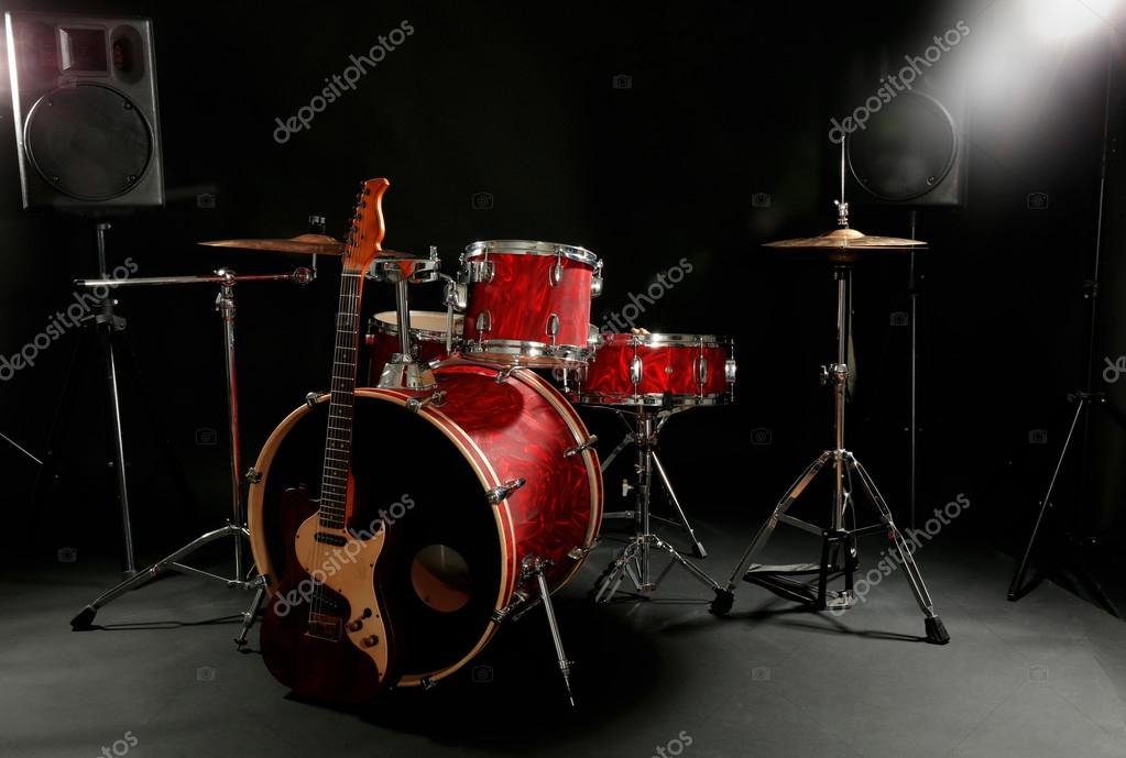Musical instruments on a stage on dark background — Stock Photo ...