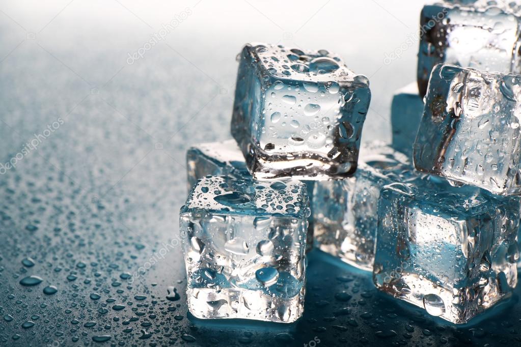Melting ice cubes with drops around, close up Stock Photo by ...