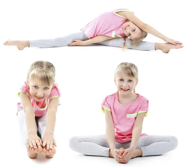 Little girl doing exercises Stock Photo by ©belchonock 70604459