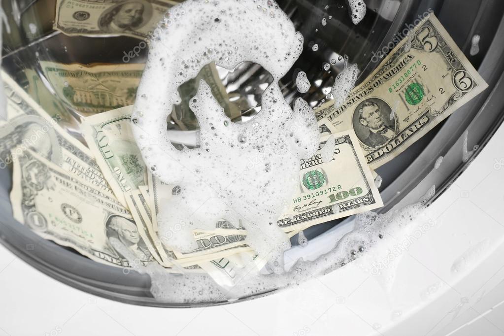 Money in washing machine Stock Photo by ©belchonock 92472628