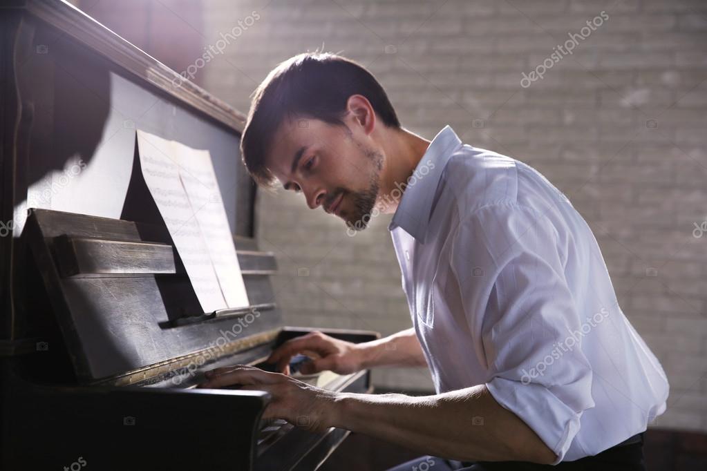 Handsome Man Playing Piano