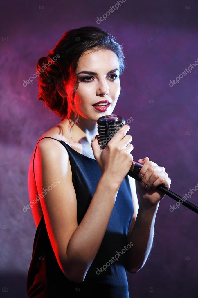 Beautiful woman singing Stock Photo by ©belchonock 95439788