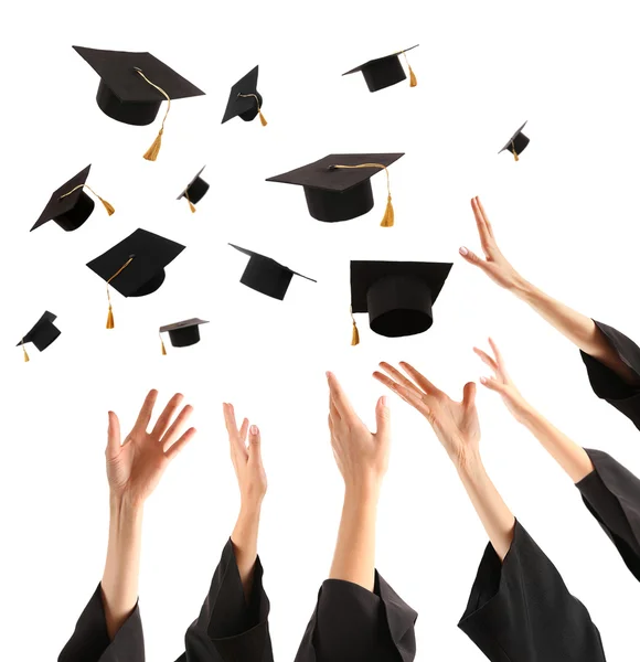 Graduates hands throwing graduation hats - Stock Image - Everypixel