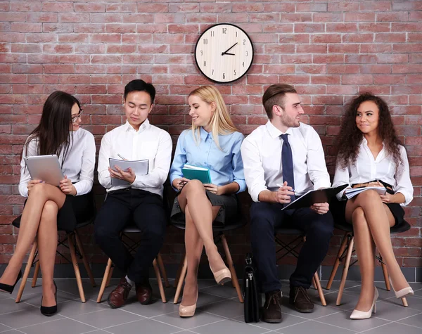 Personas sentadas en sillas: fotografía de stock © belchonock ...