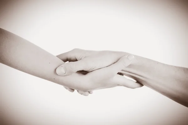 Two hands reaching toward each other. Helping concept. Vintage tone ...