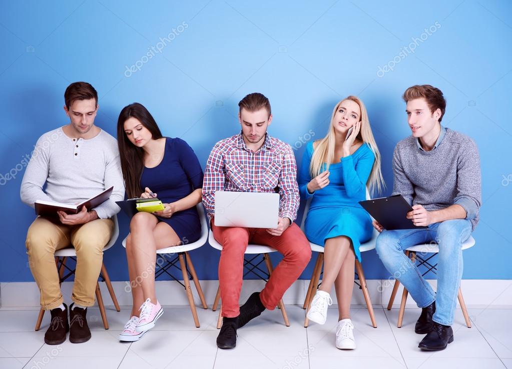 People sitting on chairs Stock Photo by ©belchonock 98650316
