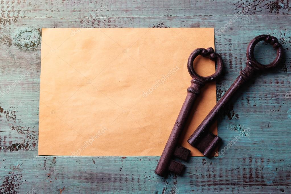 Old keys with empty sheet of paper Stock Photo by ©belchonock 99112074