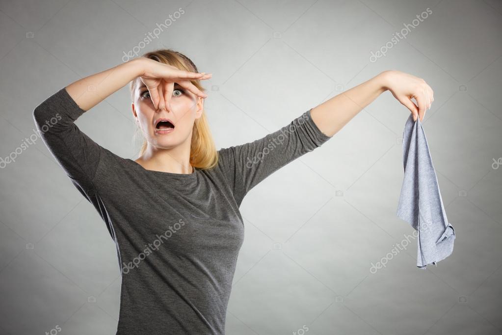 Girl with disgusting rag in hand. — Stock Photo © Anetlanda #122474192