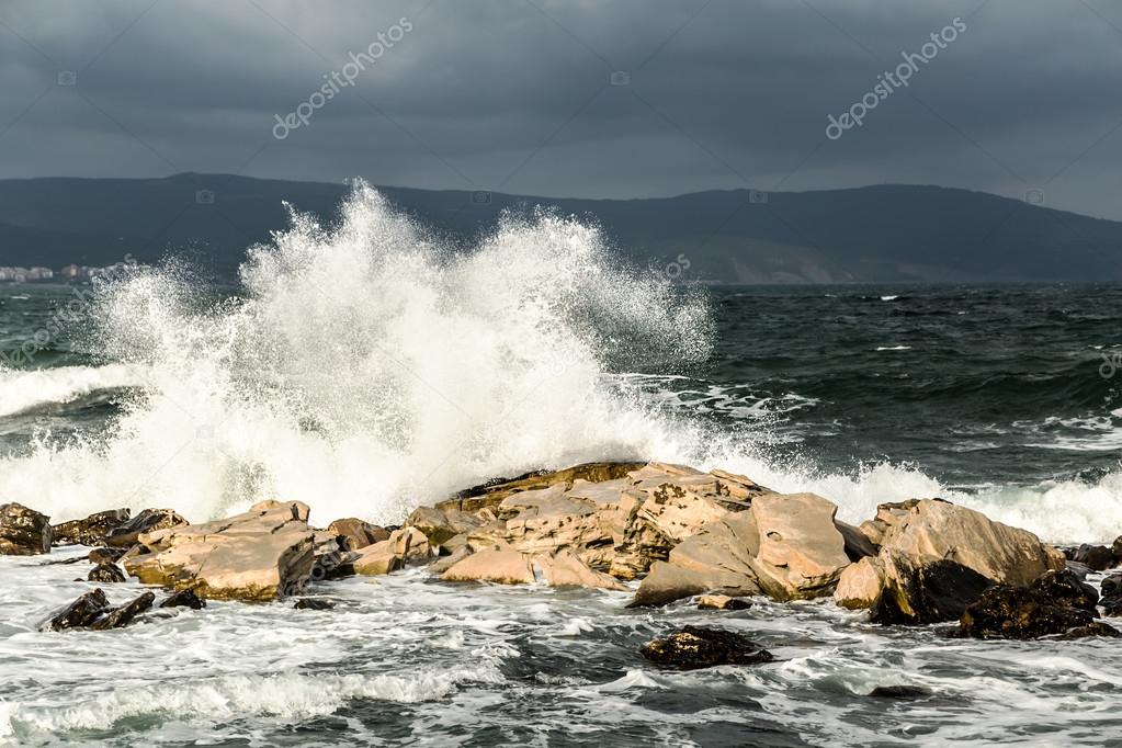 Wave crashing in the rocks Stock Photo by ©nspasov 52831189