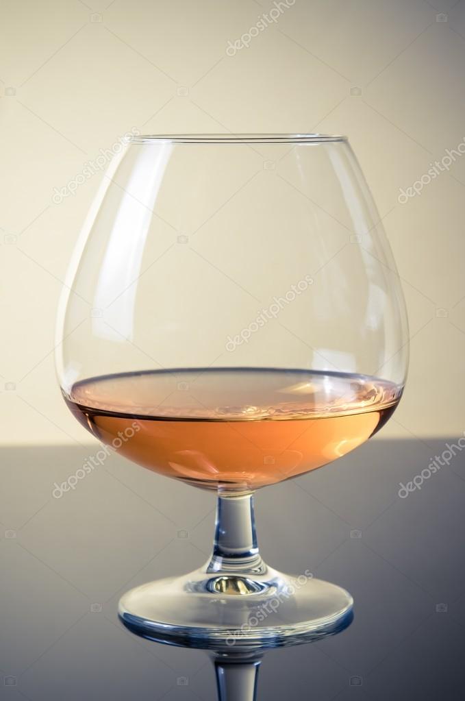Snifter of brandy in elegant typical cognac glass isolated Stock Photo ...