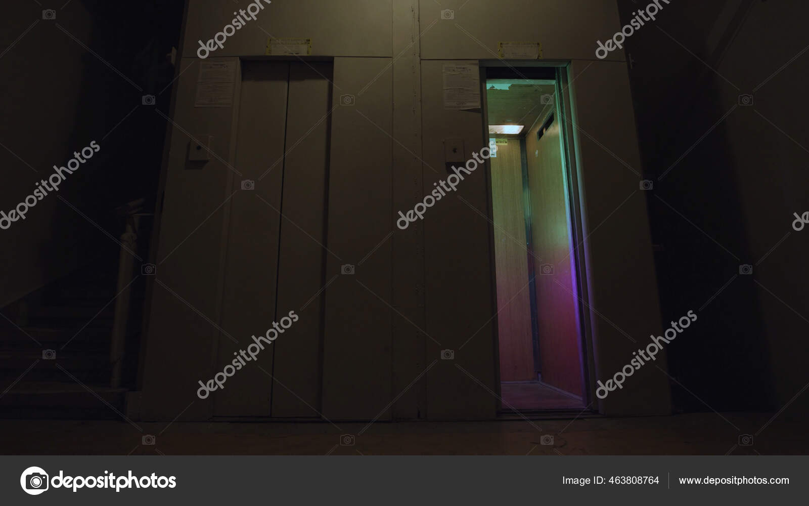 Elevator doors open and close on an empty floor with flashing disco ...