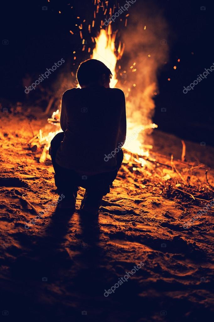 Boy near a bonfire — Stock Photo © Foto_vika #62857785