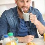 Man having breakfast Stock Photo by ©shalamov 4160957