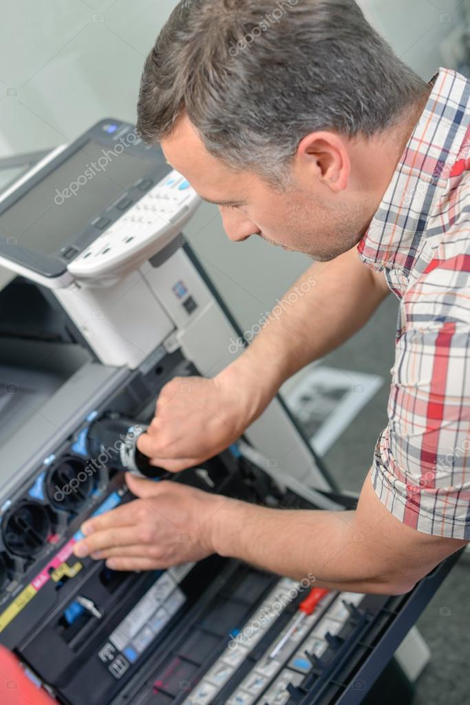 Man repairing a printer — Stock Photo © photography33 #71464409