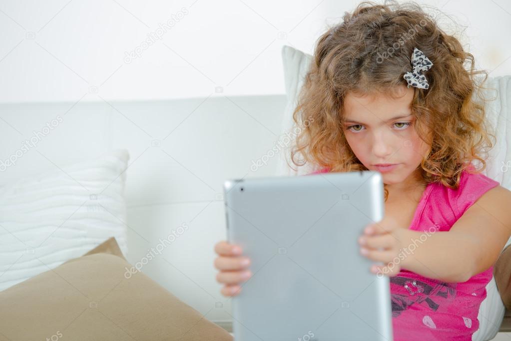 Little girl using a tablet computer Stock Photo by ©photography33 71474229