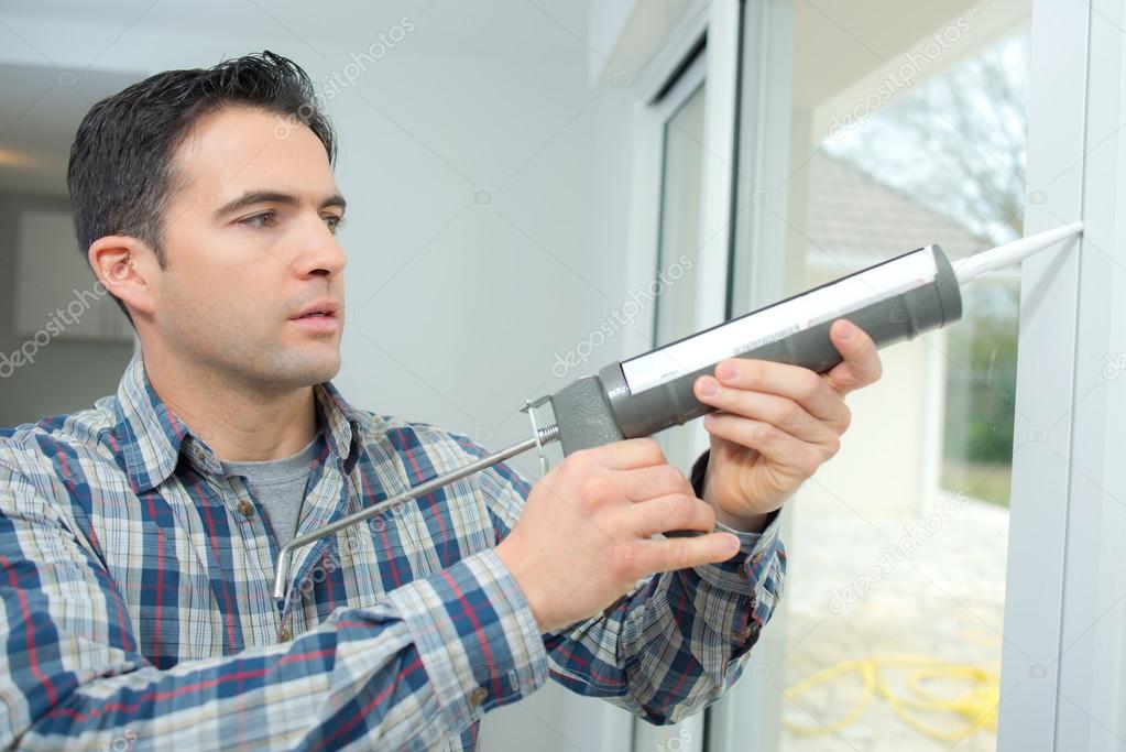 Man caulking a new window Stock Photo by ©photography33 72098521