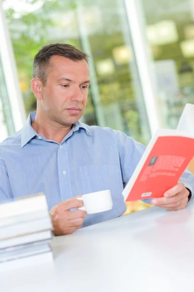 Man reading brochure Stock Photos, Royalty Free Man reading brochure ...