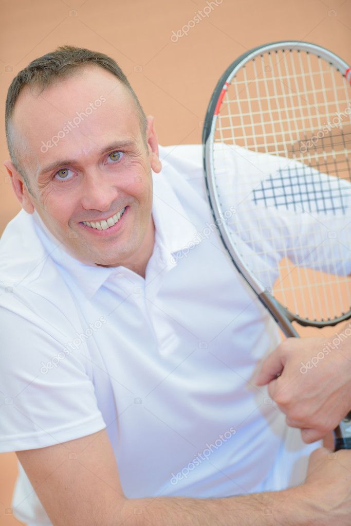Holding a tennis racket — Stock Photo © photography33 #96423394