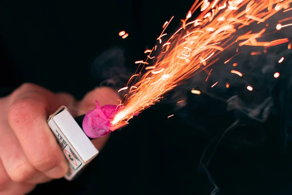 Firecracker Burning in Hand with Sparks and Smoke - Stock Image ...