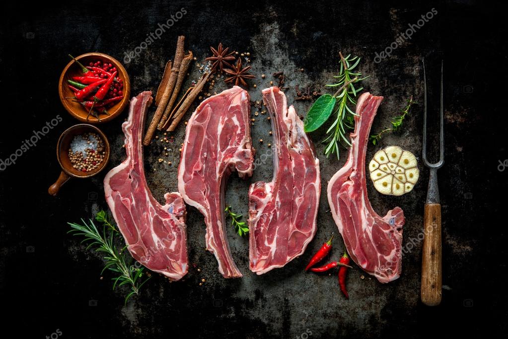 Raw fresh lamb meat on dark background Stock Photo by ©alexraths 108022864