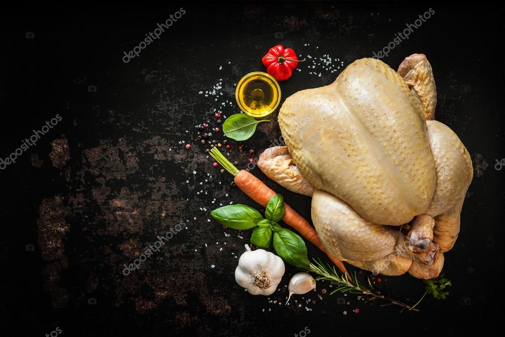 Raw chicken on the slate background Stock Photo by ©alexraths 121661862