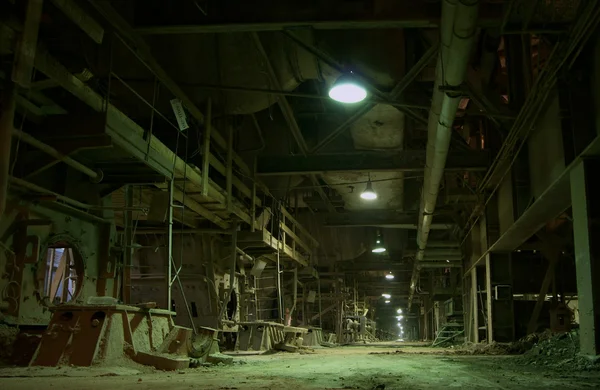Big dark empty abandoned warehouse room with window in the ceiling and ...
