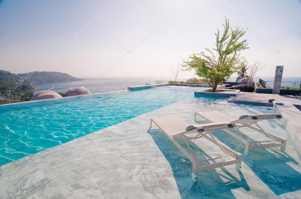 Sunny day a the swimming pool Stock Photo by ©luengo_ua 96980352