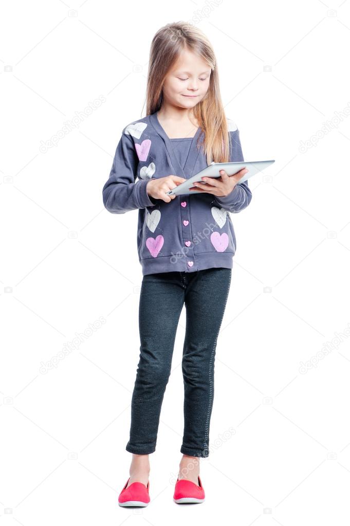 Little girl using tablet computer. — Stock Photo © luengo_ua #98134138