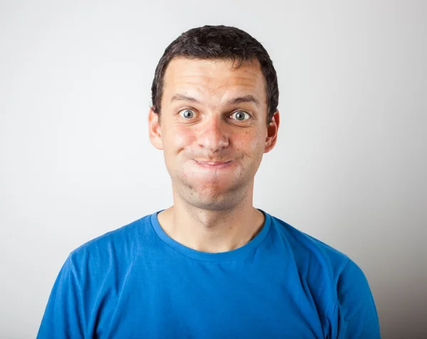 Young man expressing emotions Stock Photo by ©semisatch 78370128