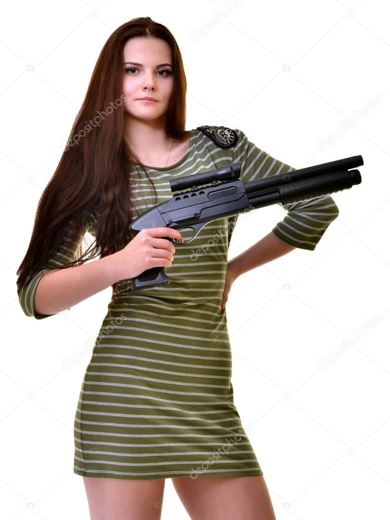 Beautiful woman standing with shotgun Stock Photo by ©muro 100461700