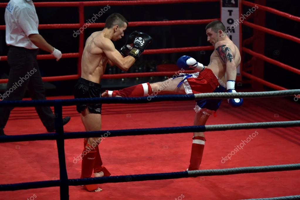 Strong fighter and his opponent during a fight in a ring Combat Fight ...