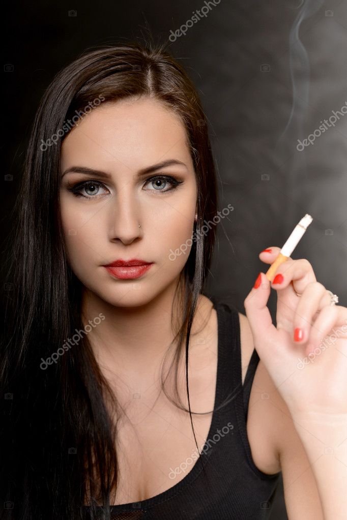 Beautiful woman smocking — Stock Photo © muro #69813203