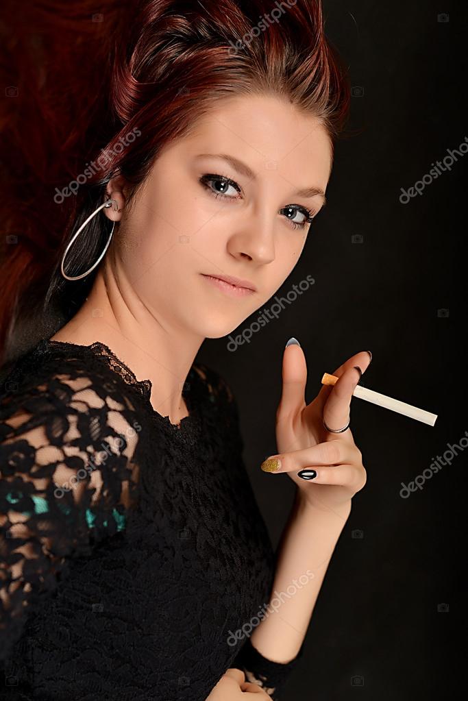 Woman Smoking a Cigarette Stock Photo by ©muro 69862741