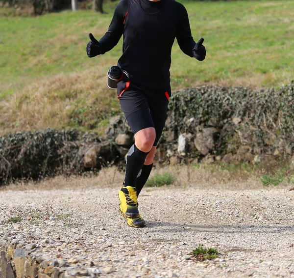 Athletic runner with sports wear during cross-country - Stock Image ...