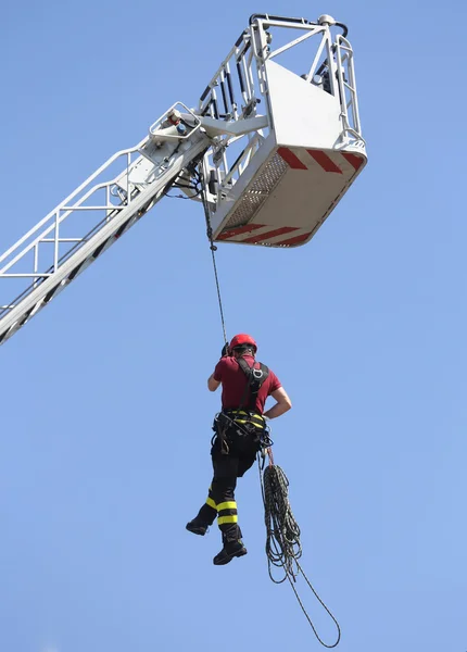 Firefighter hung the rope climbing — Stock Photo © ChiccoDodiFC #73916559