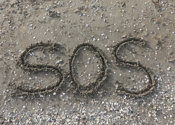 Big Text Sos Beach Sand — Stock Photo © ChiccoDodiFC #228622532